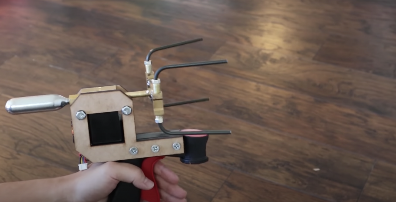 This YouTuber created a 'mask gun' that shoots masks at people's faces ...