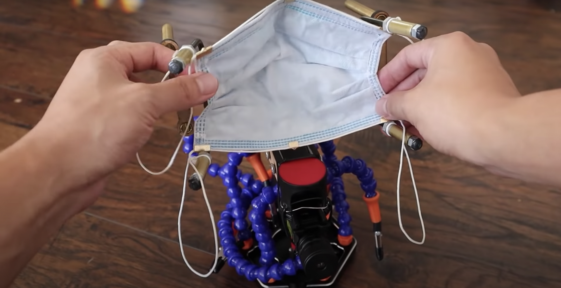 This YouTuber created a 'mask gun' that shoots masks at people's faces ...