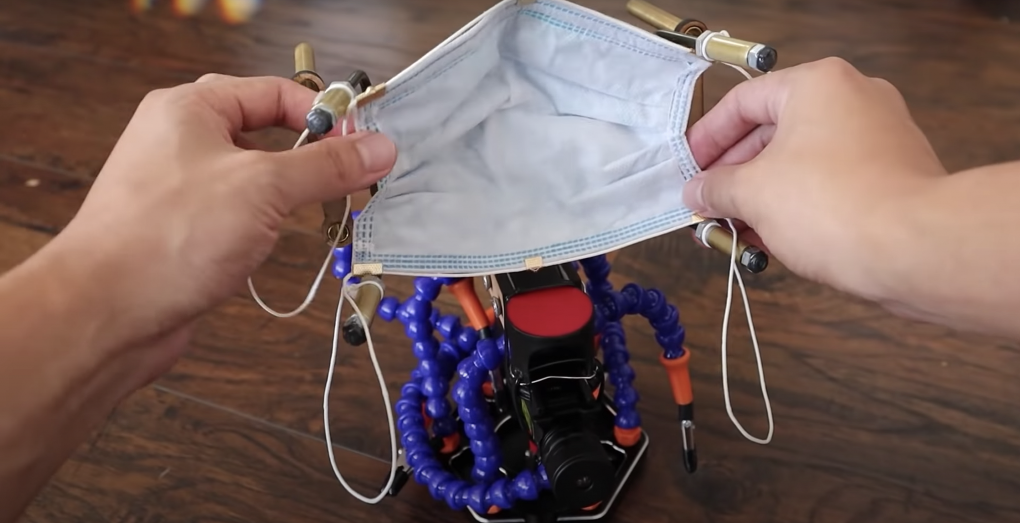 This YouTuber created a 'mask gun' that shoots masks at people's faces ...