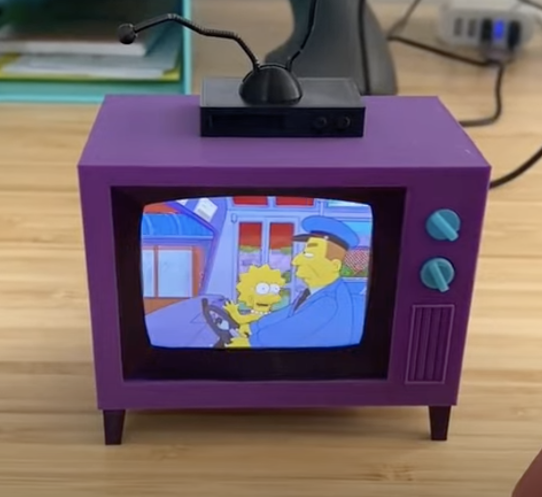 This TV plays Simpsons episodes at random, and it's also really tiny ...