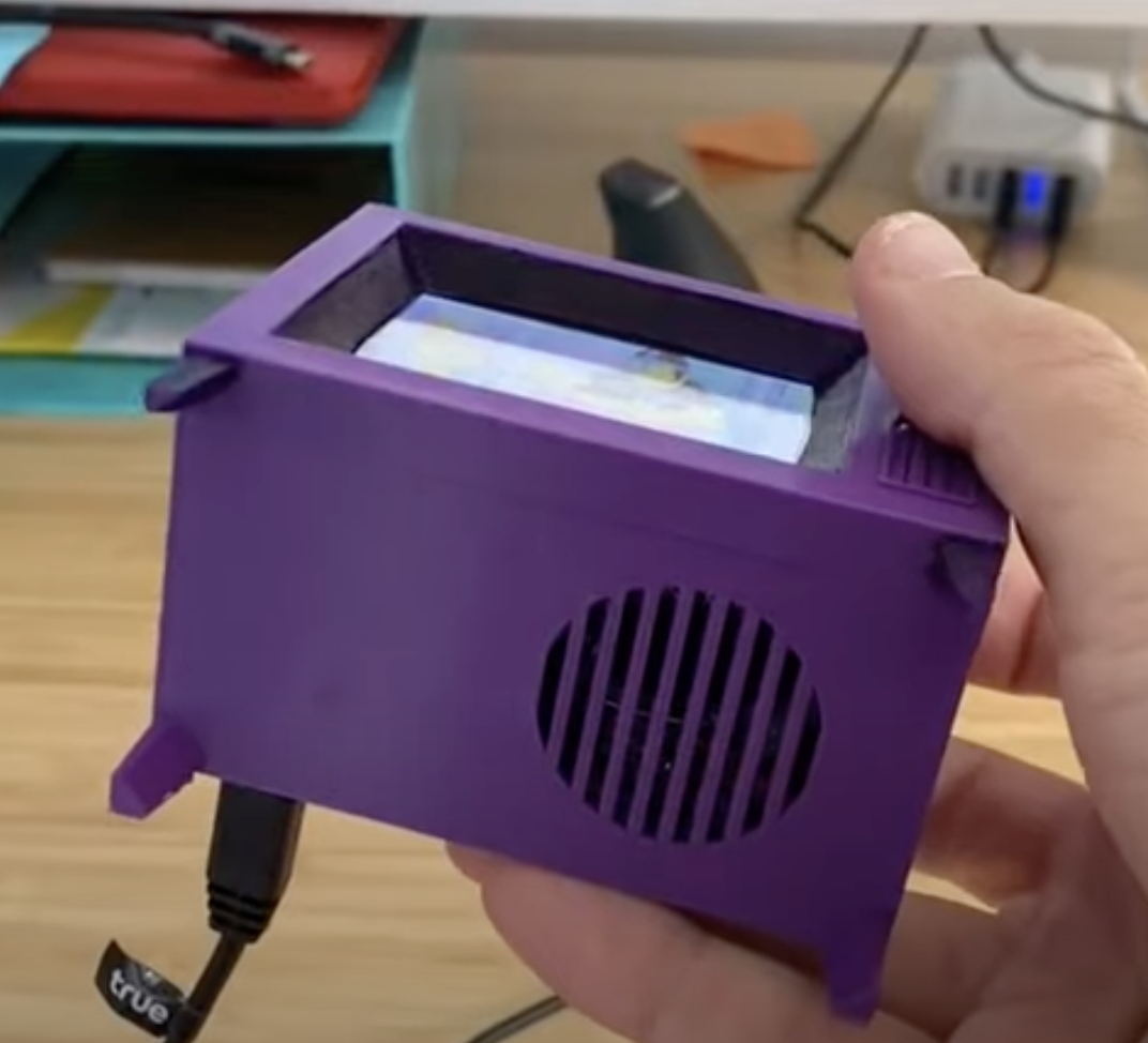 This TV plays Simpsons episodes at random, and it's also really tiny ...